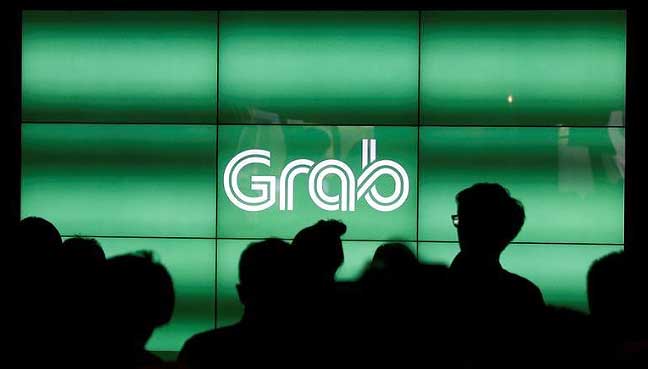 Ride-hailing firm Grab buys India-based payments startup | FMT