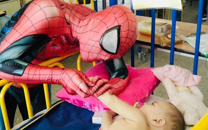 Spiderman, swinging through the cancer wards helping sick children ...