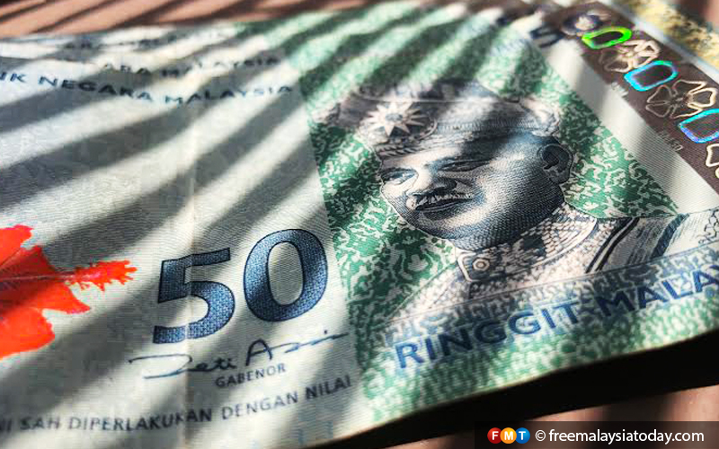 Virus concerns hit ringgit performance on opening | Free Malaysia Today ...