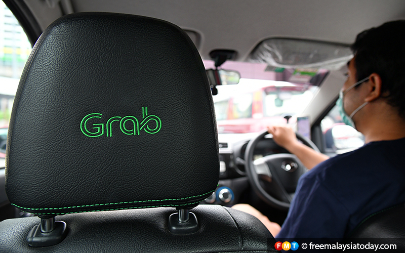 Pemandu Grab tak puas hati proses pengesahan dokumen makan masa lama | FMT