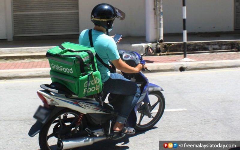 Food deliveries soar, but riders bear the cost | FMT