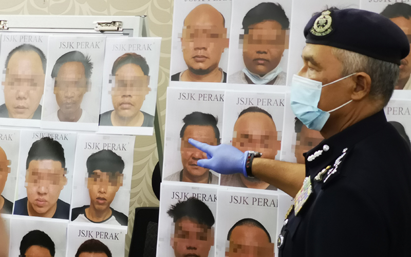 Macau scam syndicate busted in Perak, 22 arrested | FMT