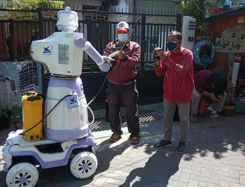 Indonesian village turns trash into homemade robot Covid helper | Free ...