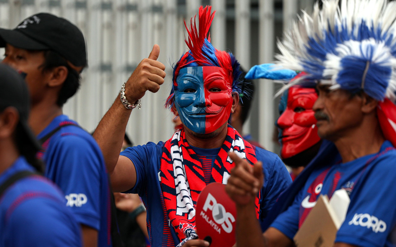 Tiger costume and Trojan hairdo catch the eye at Cup final | Free ...