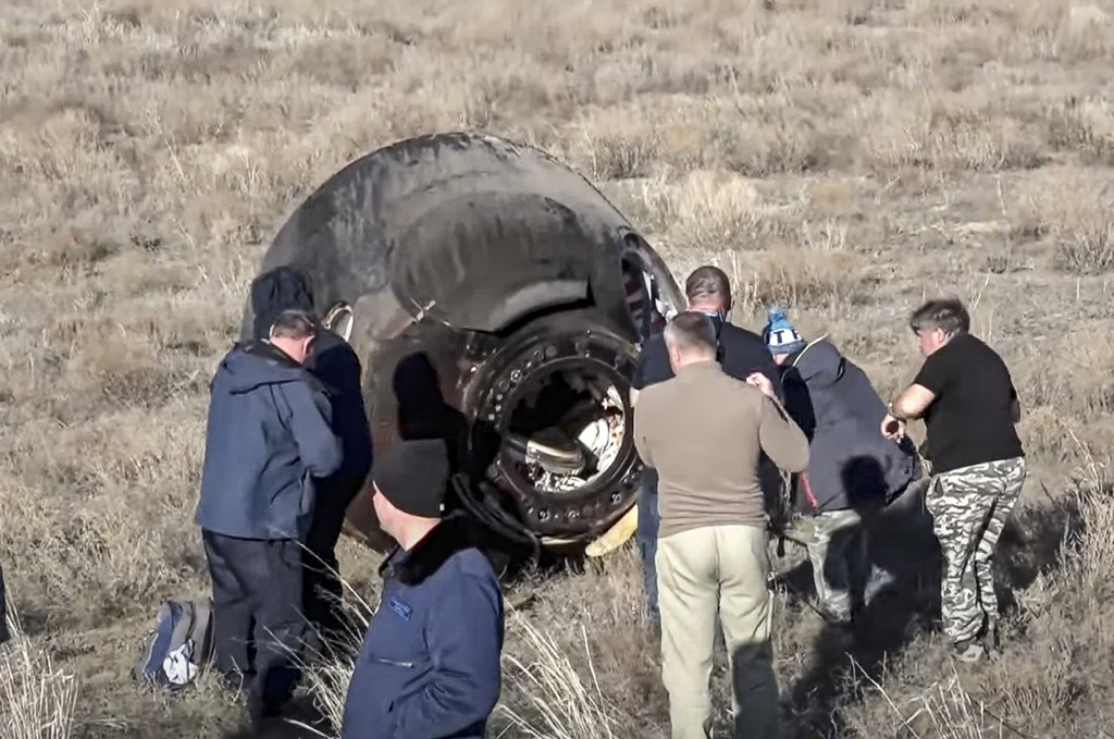 Damaged Russian Soyuz capsule lands back on Earth from ISS | Free ...