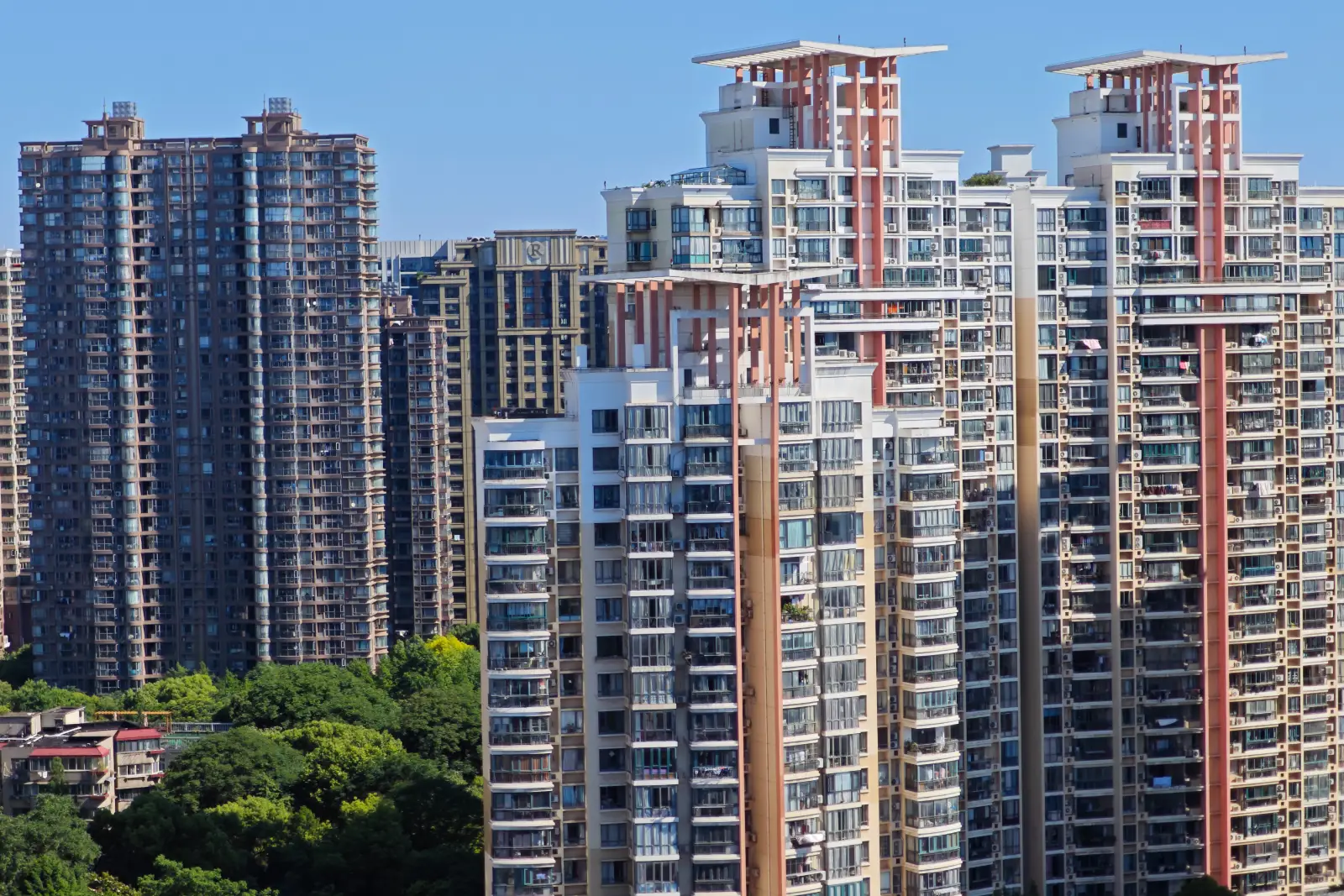 Shanghai lifts home-buying curbs to boost property sector | FMT