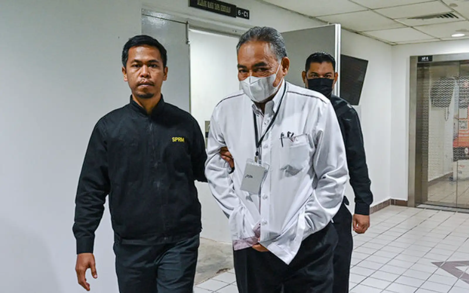 Senior religious affairs dept officer charged with 24 counts of power ...