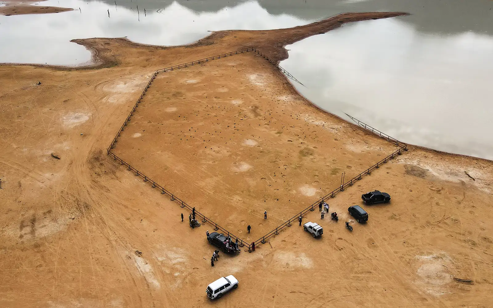 Receding water levels at dam expose 100-year-old graves | FMT