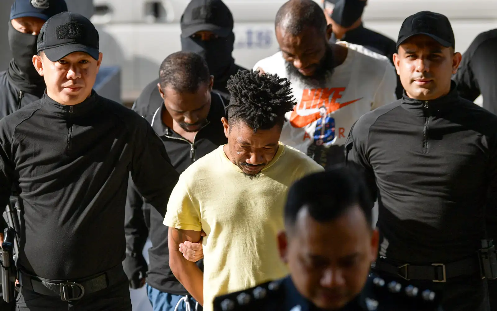 3 African men charged with robbing Japanese businessman of US$30,000 | FMT