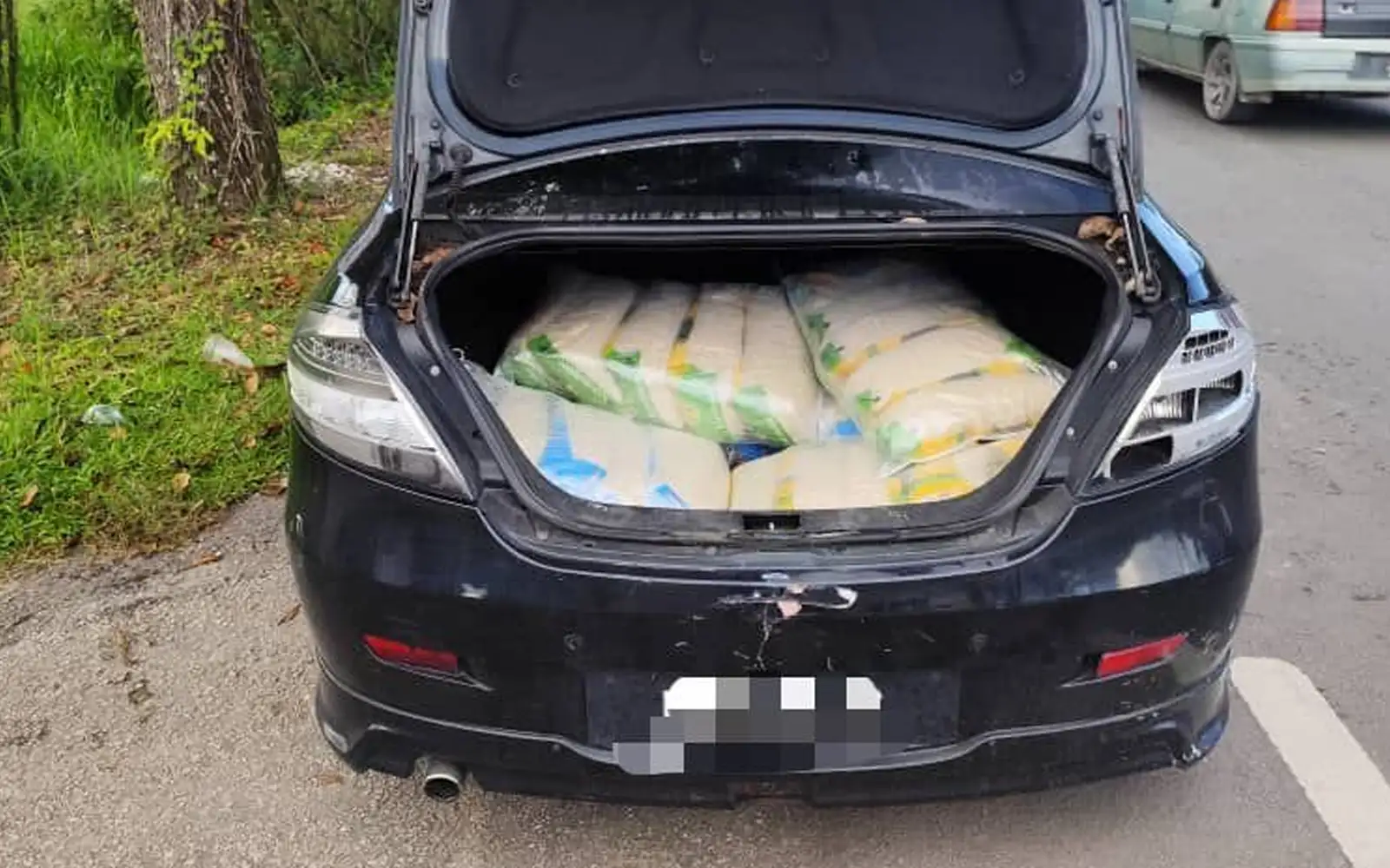 Boy, 15, caught smuggling 475kg of rice in car | FMT